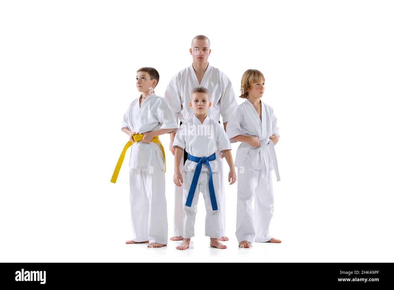 Portrait of group of kids, boys, taekwondo or karate athletes standing ...