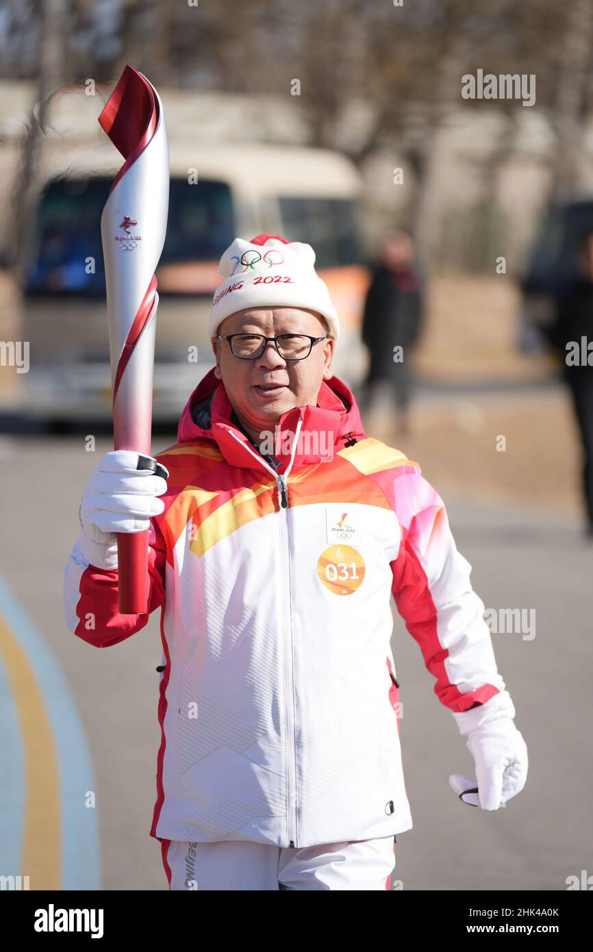 Beijing, China. 2nd Feb, 2022. Torch bearer Yao Yabo runs with the torch during the Beijing 2022 ...