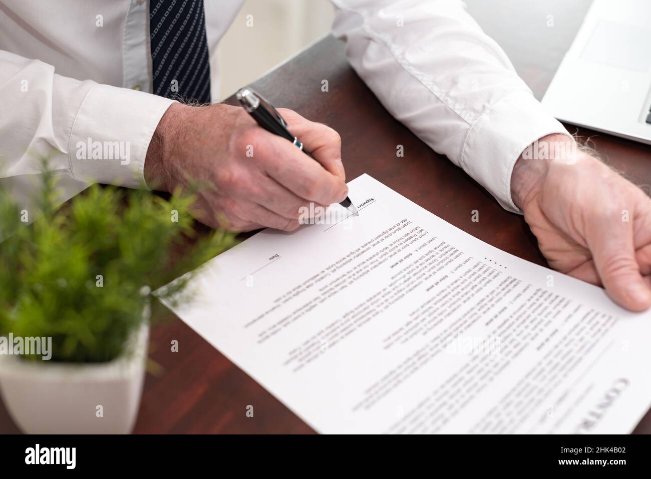 Hand of businessman signing a contract (Lorem ipsum text used Stock ...
