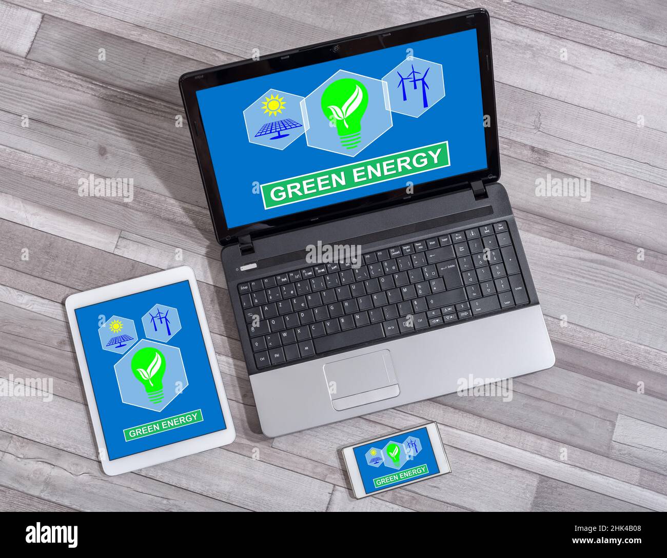 Green energy concept shown on different information technology devices ...