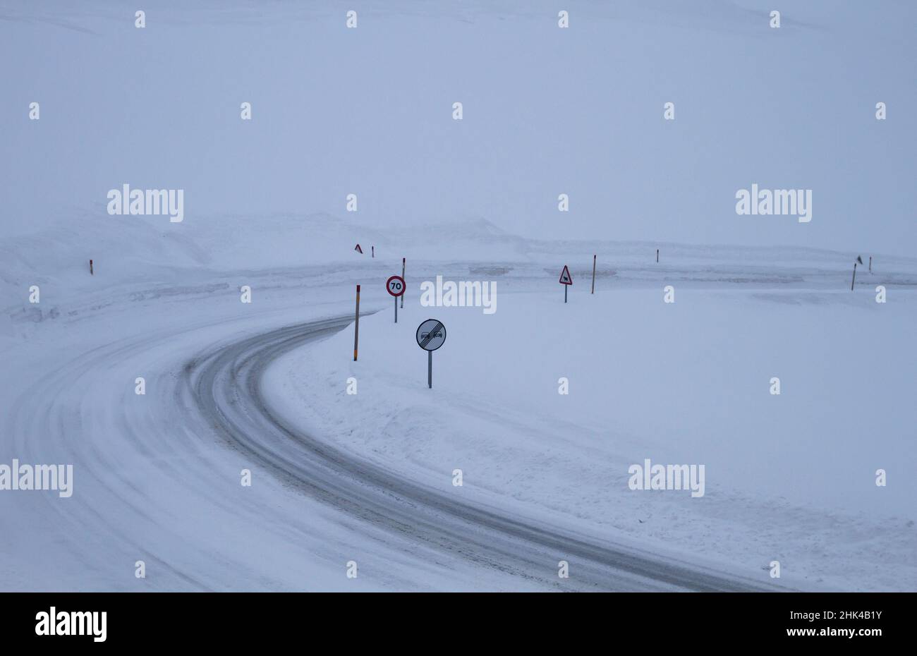 Curvy road in snowy mountain Stock Photo - Alamy
