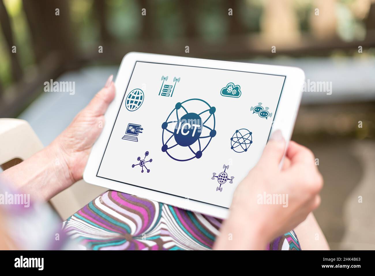 Ict concept shown on a tablet held by a woman Stock Photo - Alamy
