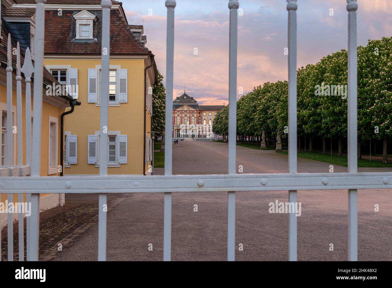 View on Bruchsal castle through a gate, at sunset Stock Photo - Alamy