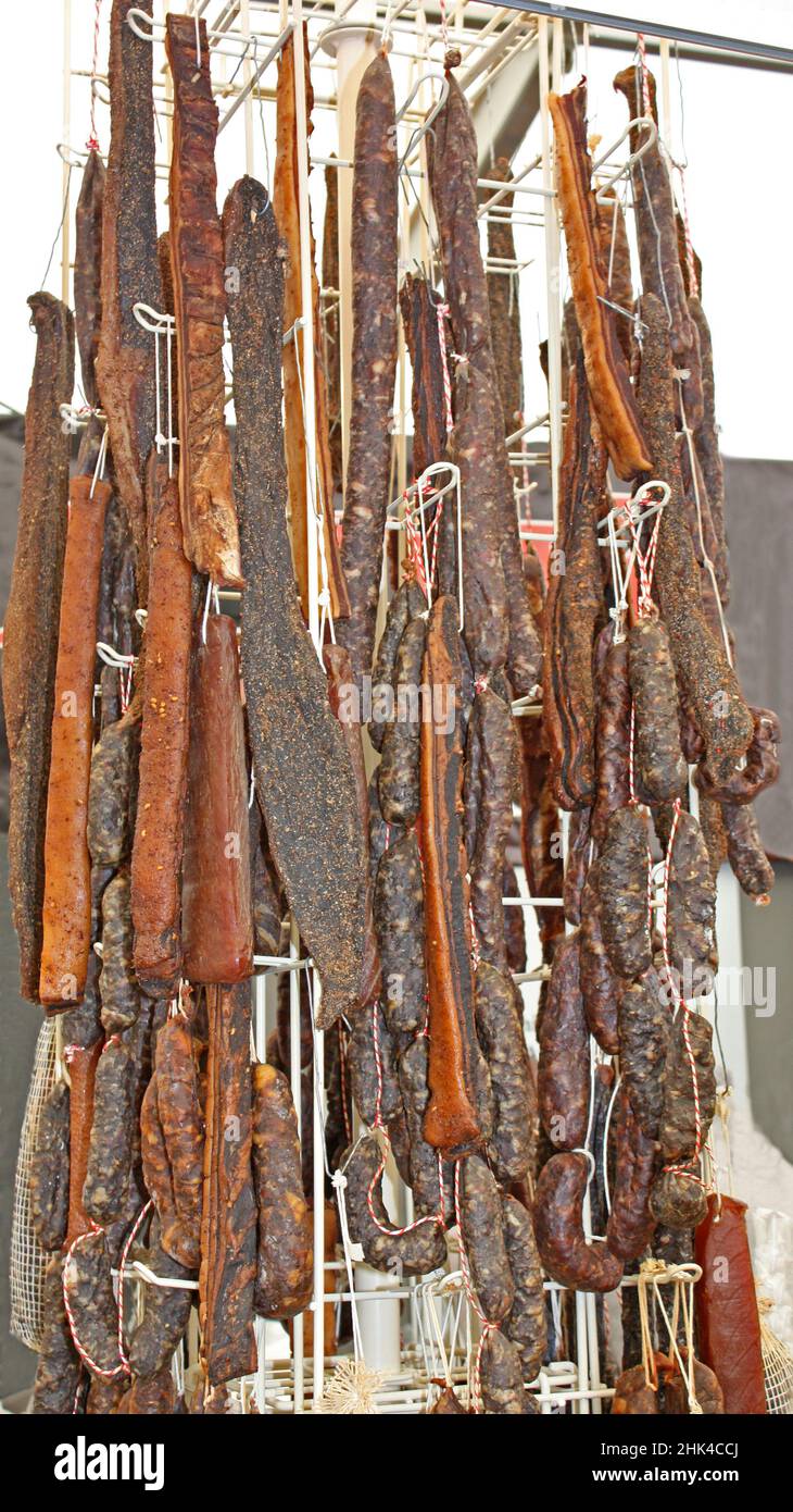 A Hanging Display of Various Smoked Meats Stock Photo - Alamy