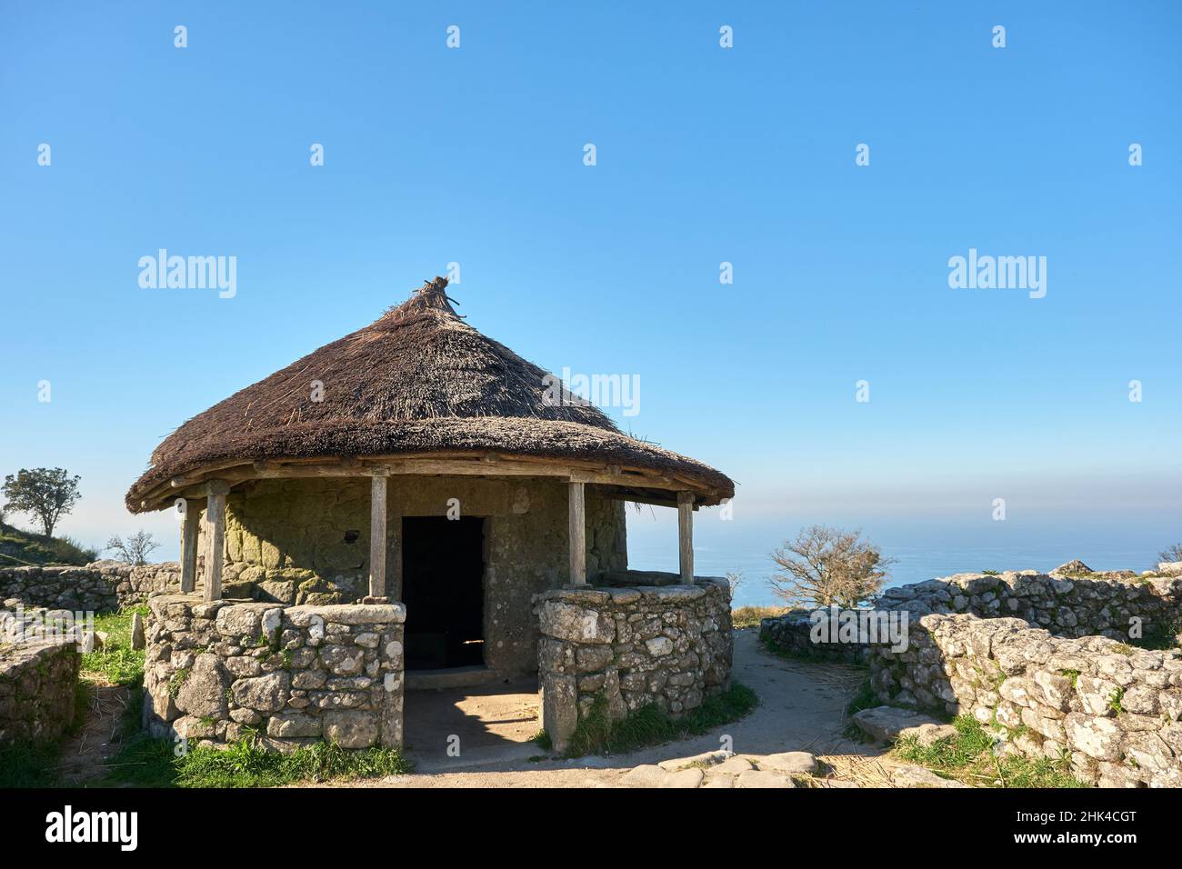 Reconstruction of old celtic stone dwelling with wicker roof in Castro ...