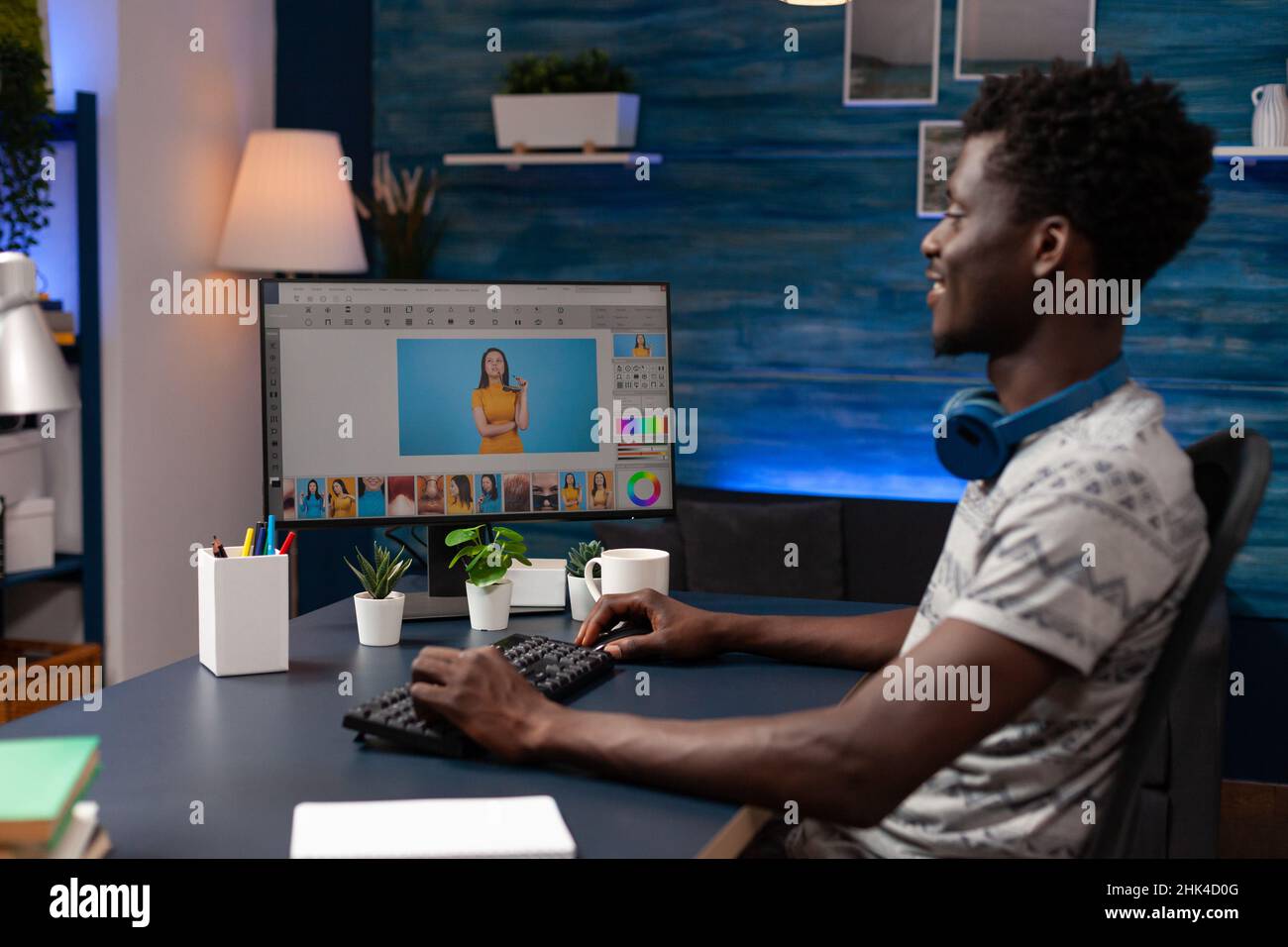 Photographer illustrator artist retouching pictures correcting contrast ...