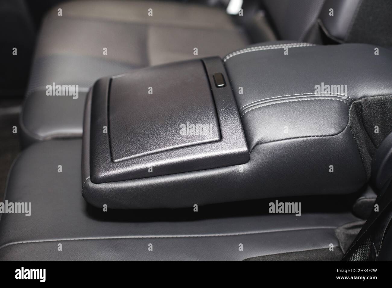 Luxury car rear seat cup holders with control panel Stock Photo - Alamy