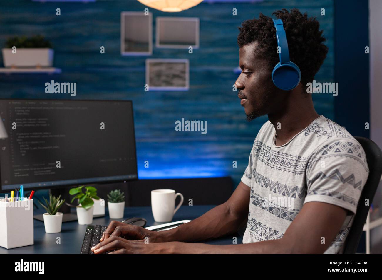 It businessman wearing headphones programming codes for firewall server ...