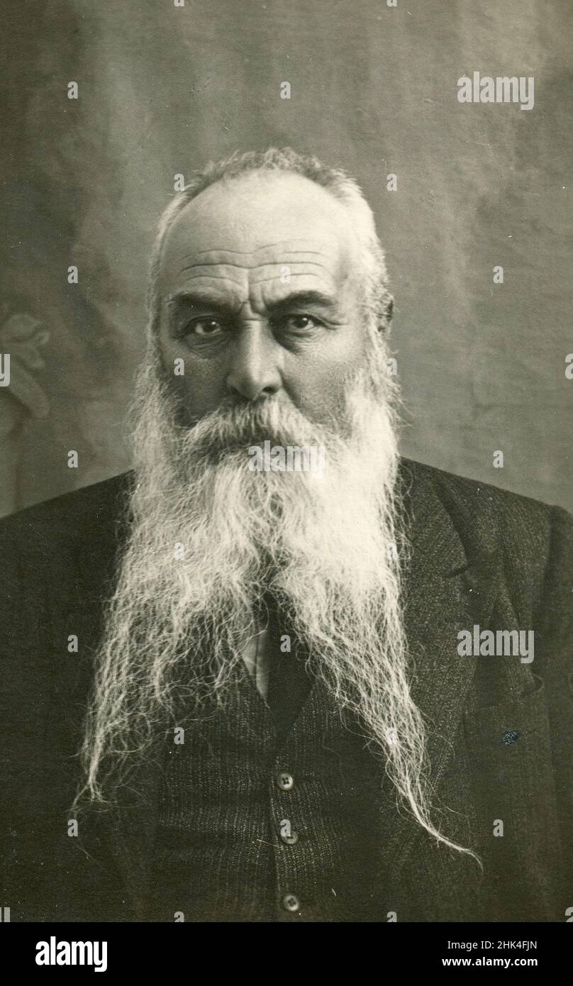 Old man with very long white forked bear, Italy 1920s Stock Photo - Alamy