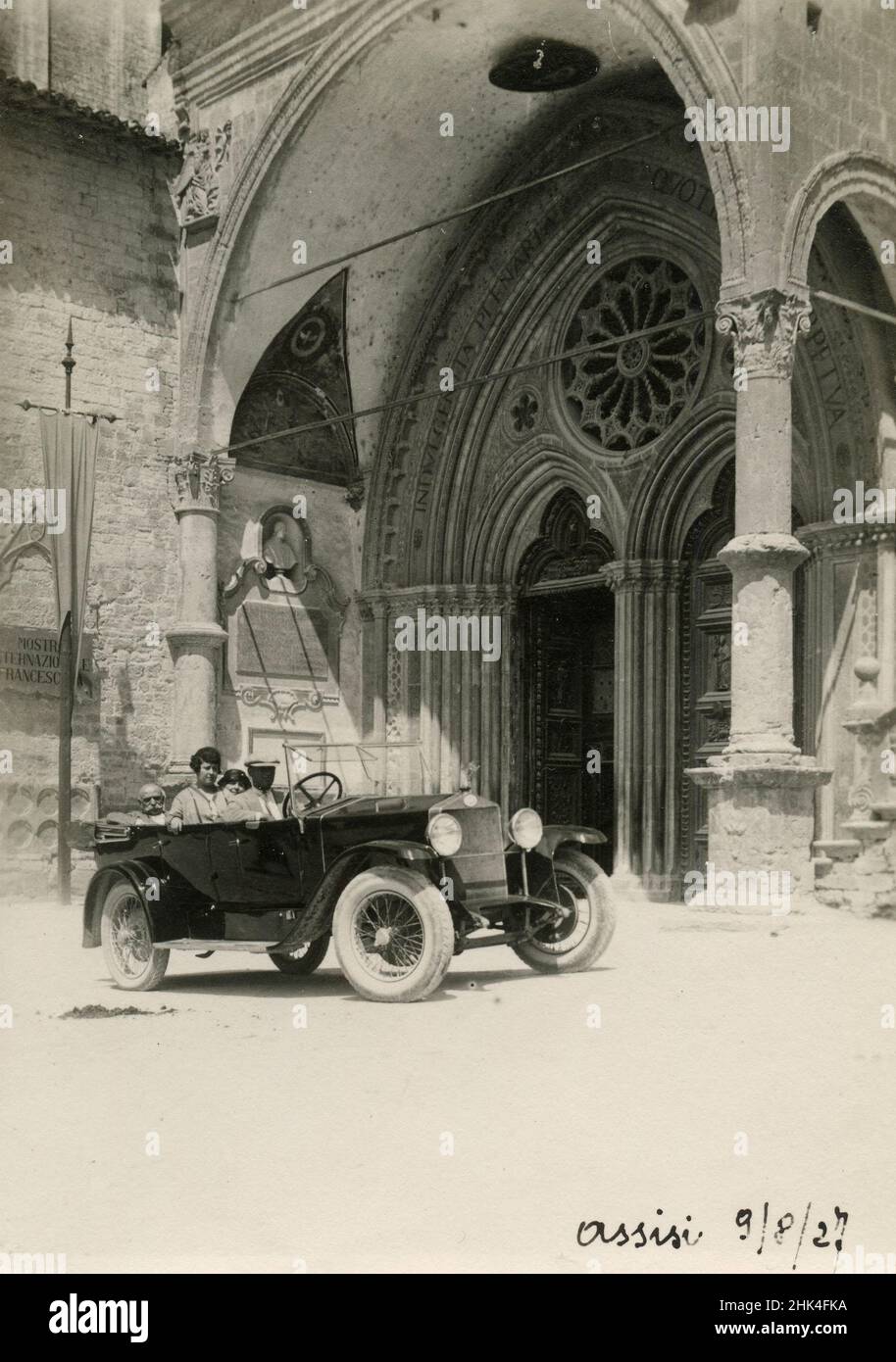 In the convertible car outside the cathedral, Assisi, Italy 1927 Stock ...