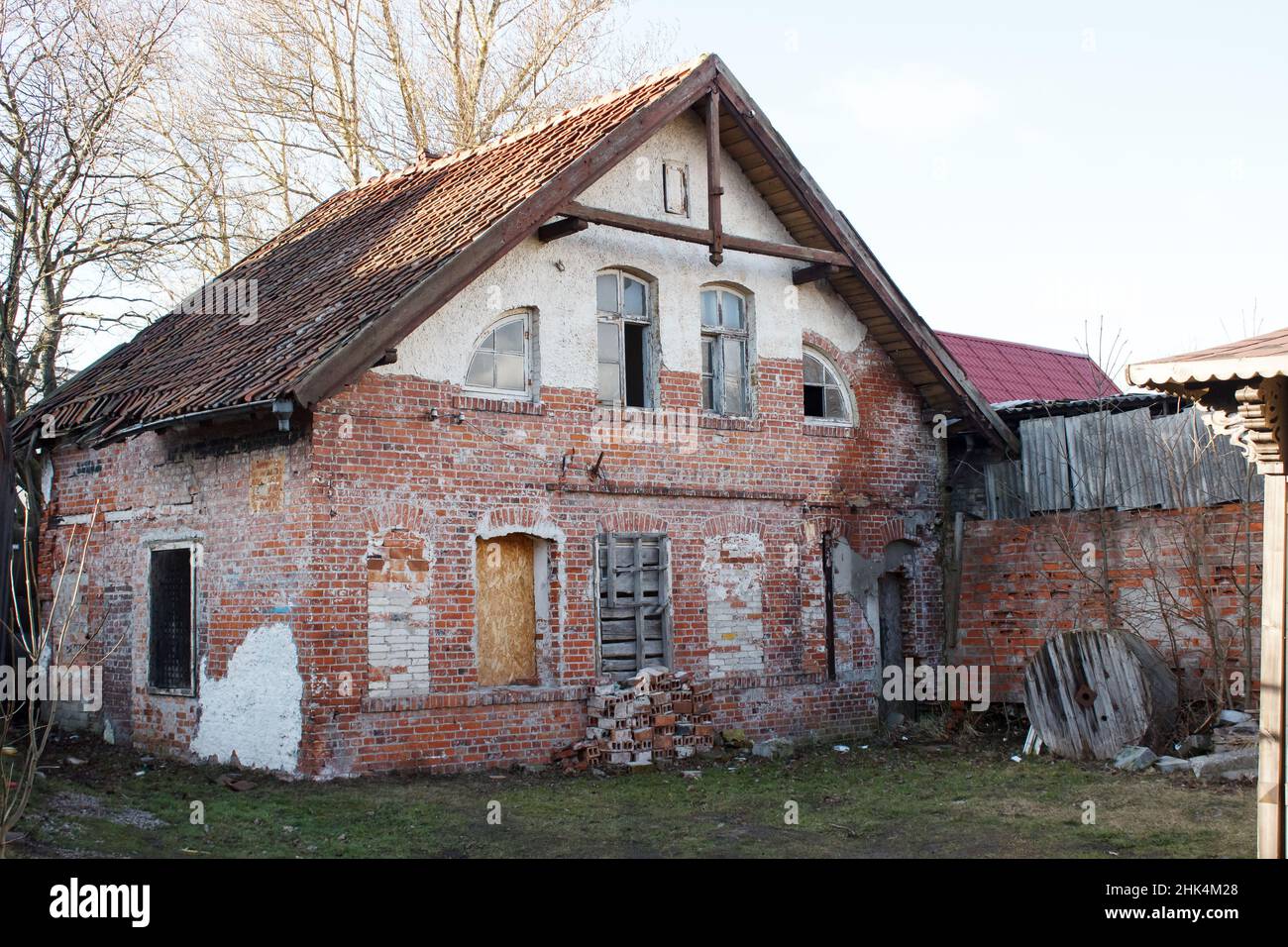 old abandoned decaying house at city street on sunny day Stock Photo ...