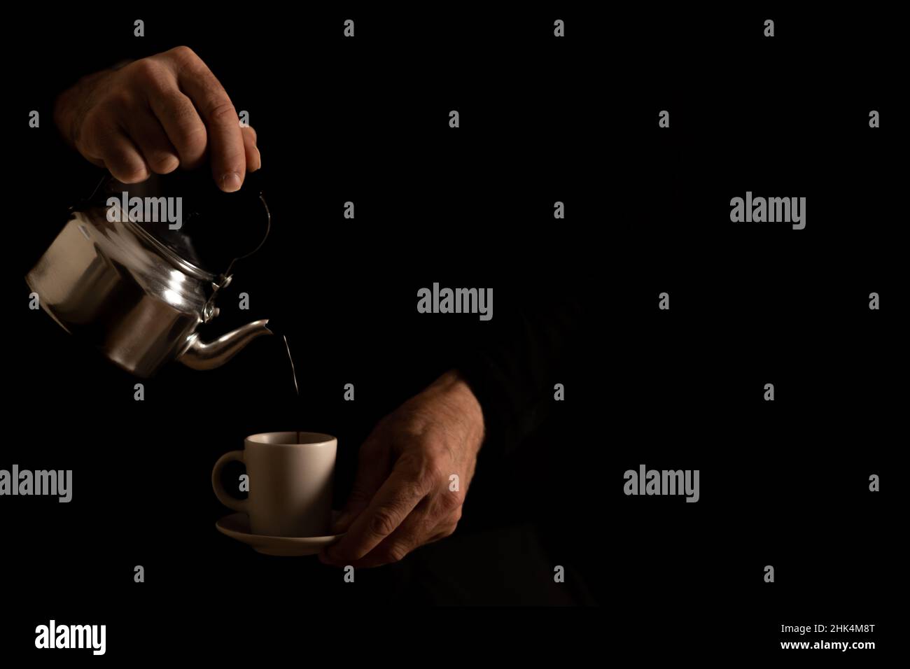 man's hands serving coffee Stock Photo - Alamy