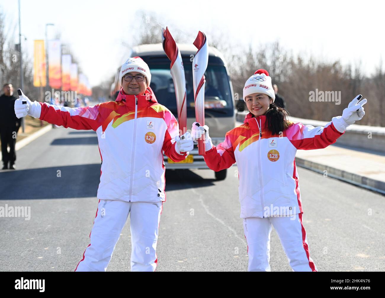 Beijing, China. 2nd Feb, 2022. Torch bearers Chen Ke (L) and Xiong Ling ...