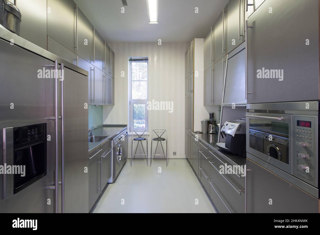 Modern interior of metal kitchen in luxury apartment. Home appliances ...