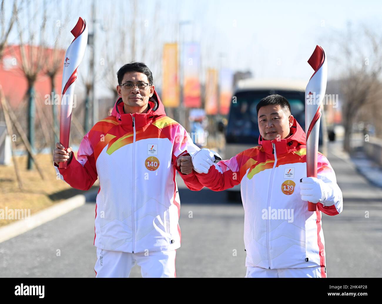 Beijing, China. 2nd Feb, 2022. Torch bearers Li Shucheng(L) and Ouyang ...