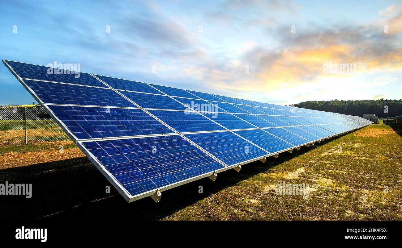 Solar panels on sunset. Industrial landscape with photovoltaic power ...