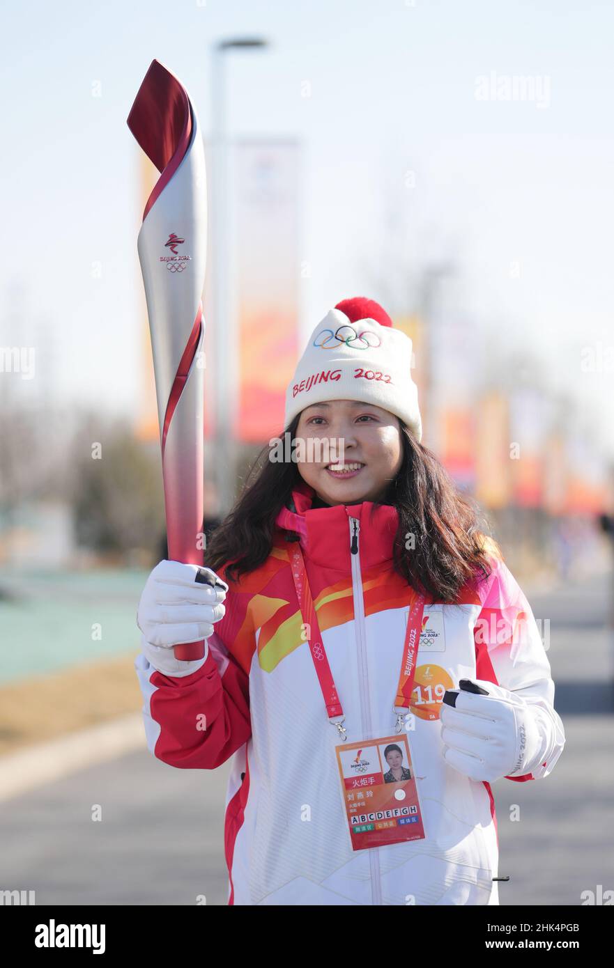 Beijing, China. 2nd Feb, 2022. Torch bearer Liu Yanling runs with the ...
