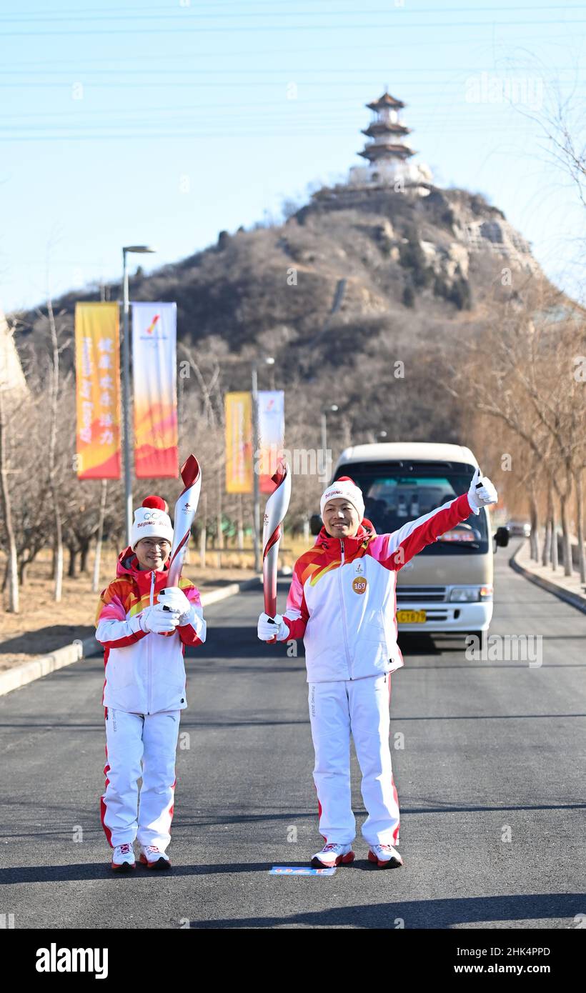 Beijing, China. 2nd Feb, 2022. Torch bearers Zhang Runshi(L) and Ding ...