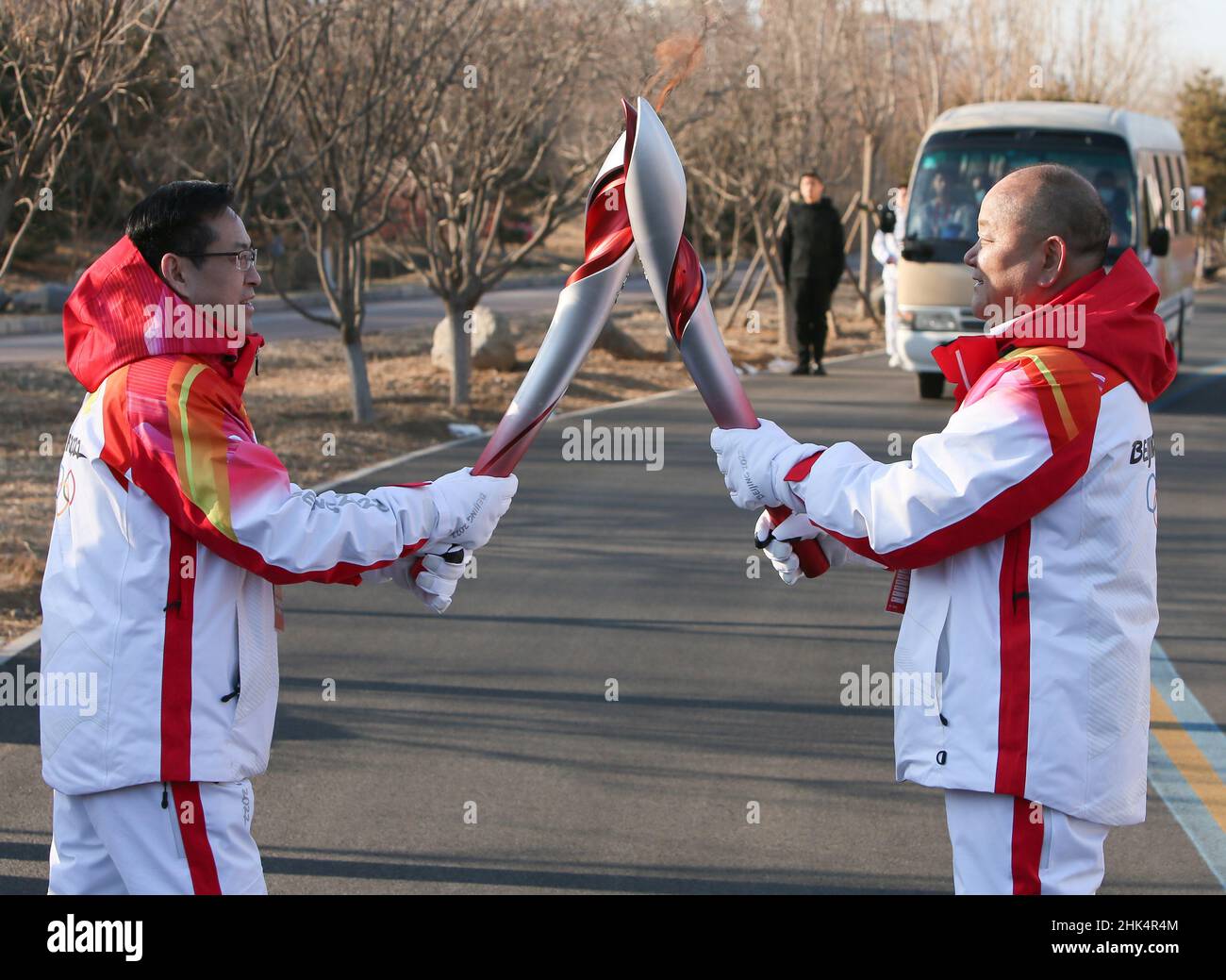 Beijing, China. 2nd Feb, 2022. Torch bearers Zhang Jinzhong (L) and ...