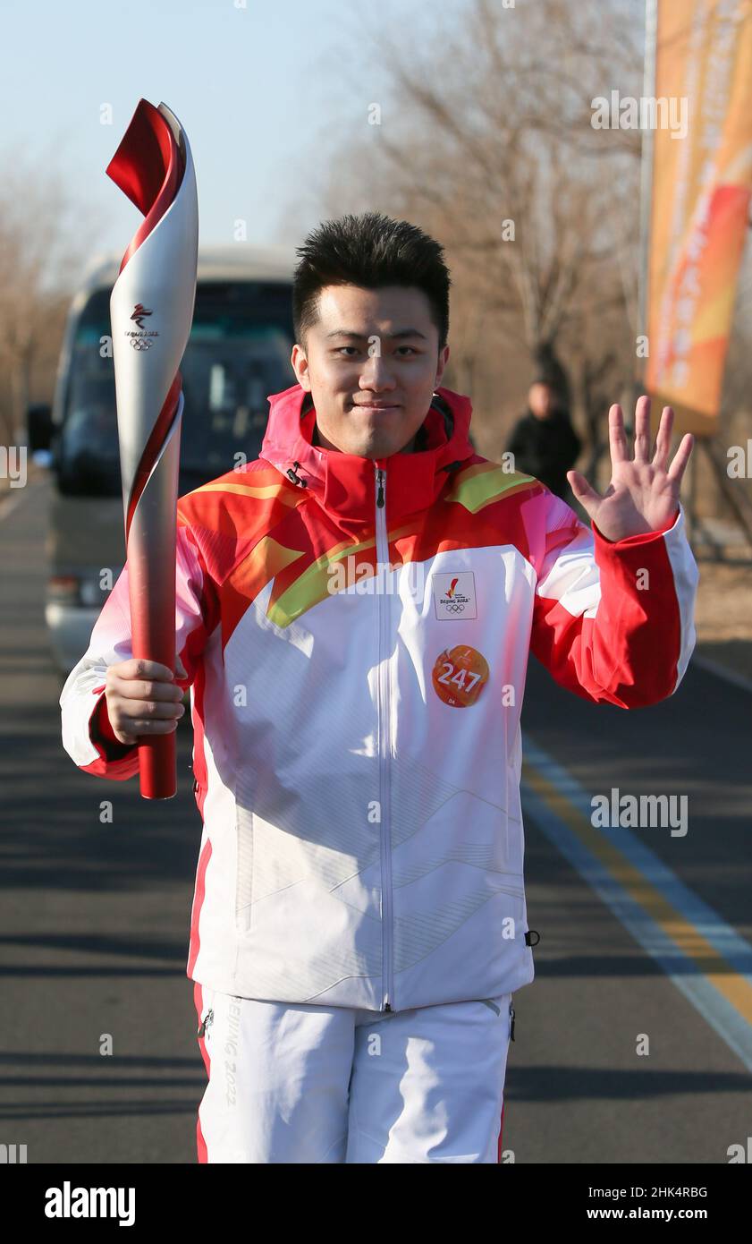 Beijing, China. 2nd Feb, 2022. Torch bearer Li Yang runs with the torch during the Beijing 2022 ...