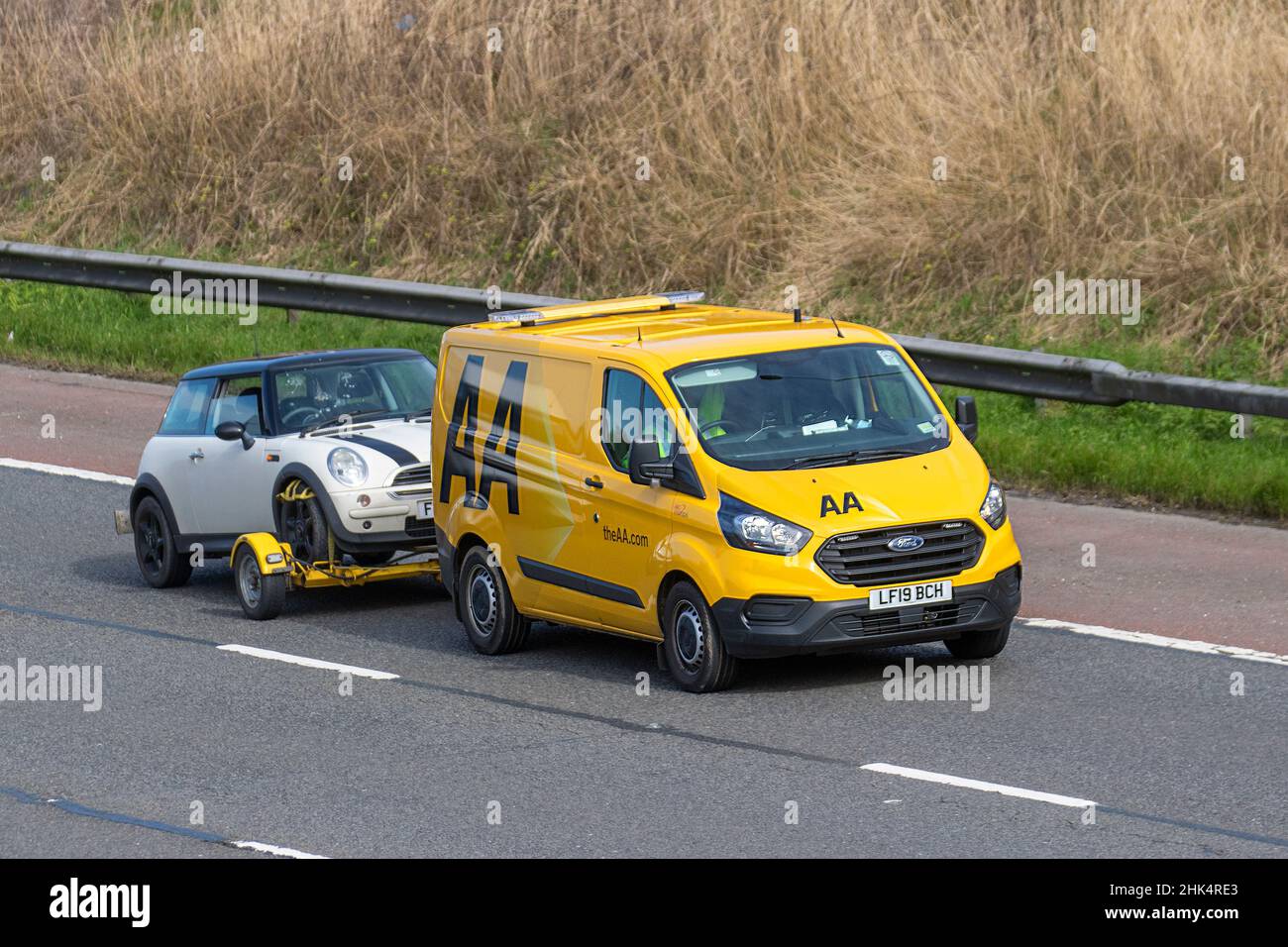2019 yellow Ford Transit Custom 1995cc towing MINI One; AA, roadside ...