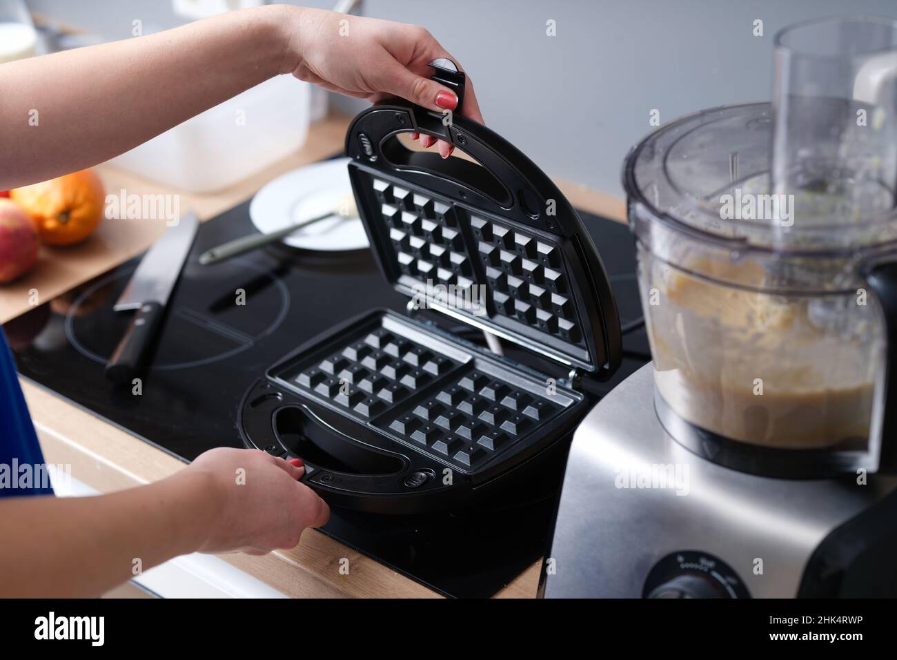 Multi cooking open lid hand hi-res stock photography and images - Alamy