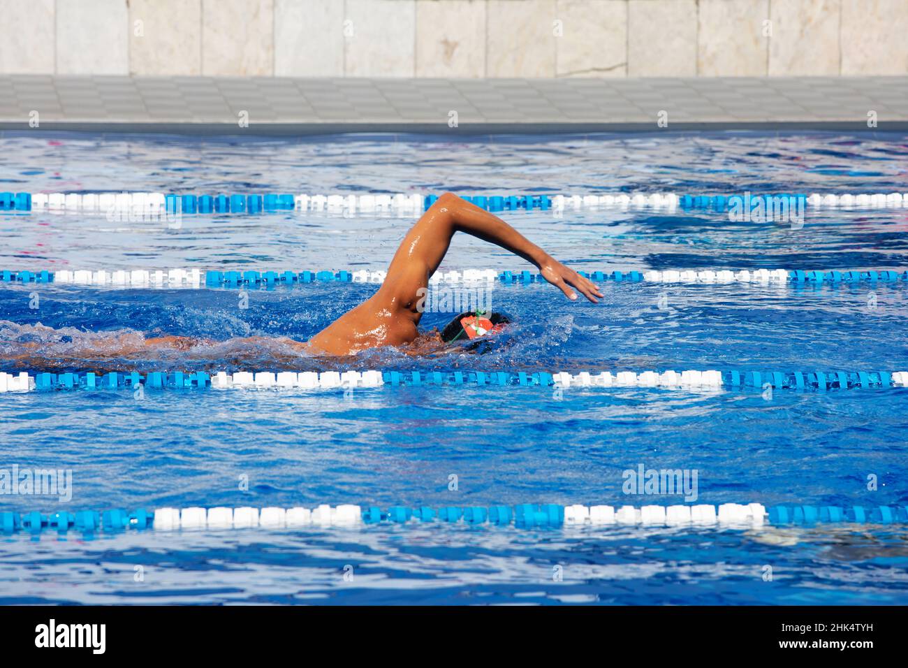 Professional male swimmer swimming in the pool Stock Photo - Alamy
