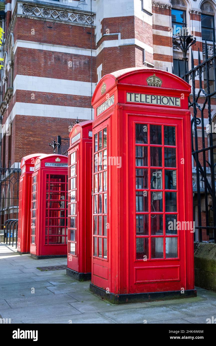 Traditional red metal K6 telephone boxes designed by Sir Giles Gilbert Scott, Holborn, London ...