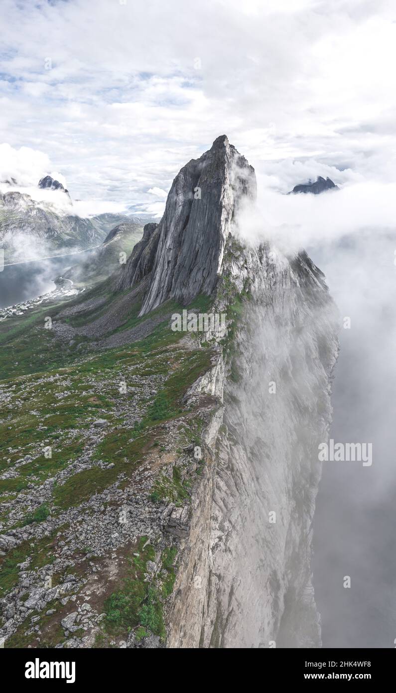 Aerial panoramic view of Mount Segla emerging from fog, Senja island ...