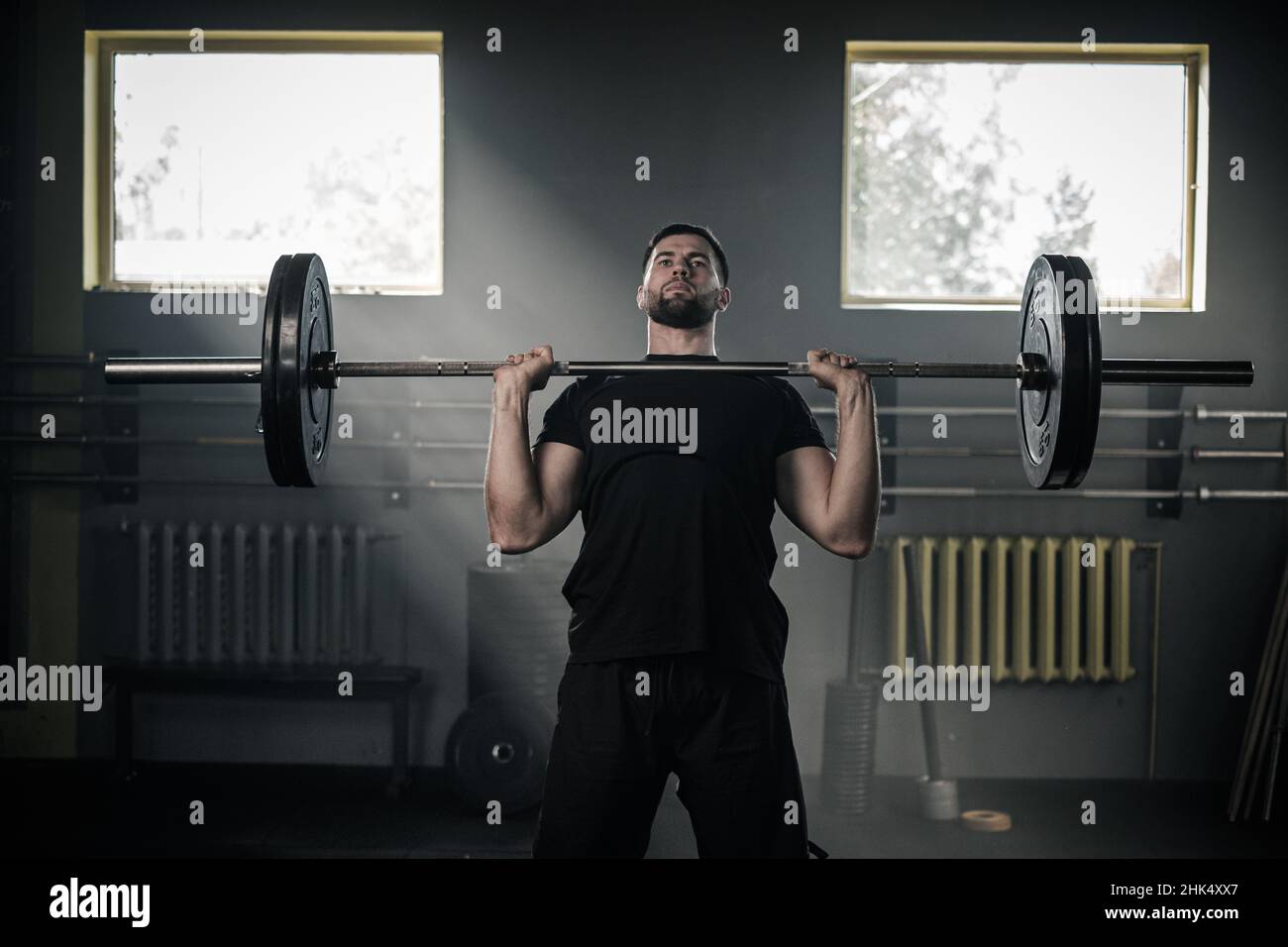 Athlete Man Do Workout With Barbell Stock Photo - Alamy