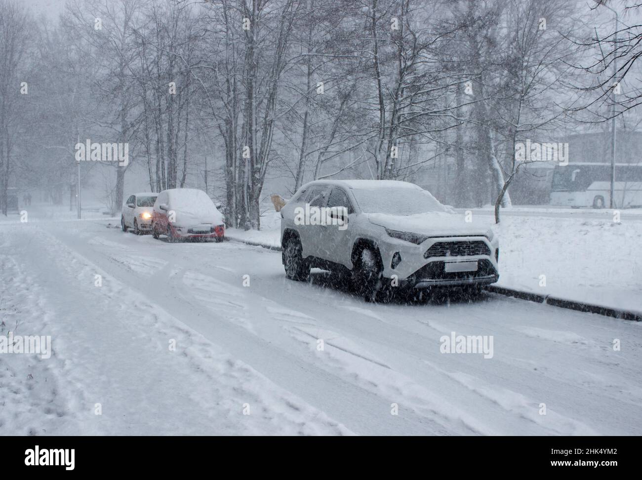 snowfall in the city in gloomy winter day Stock Photo - Alamy
