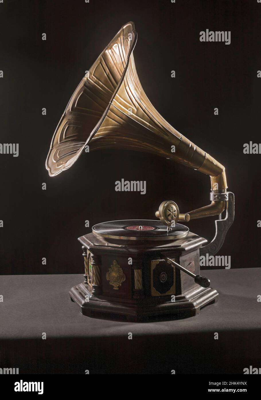 Old fashioned gramophone with bell loudspeaker on black background ...