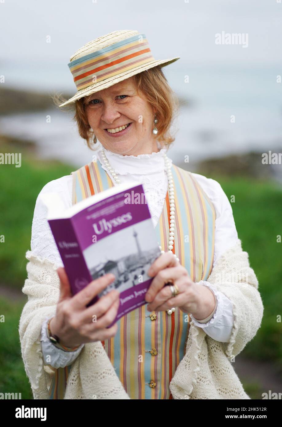 Anne Tyrrell Gogan reads a copy of Ulysses on Sandycove Point, Dublin ...
