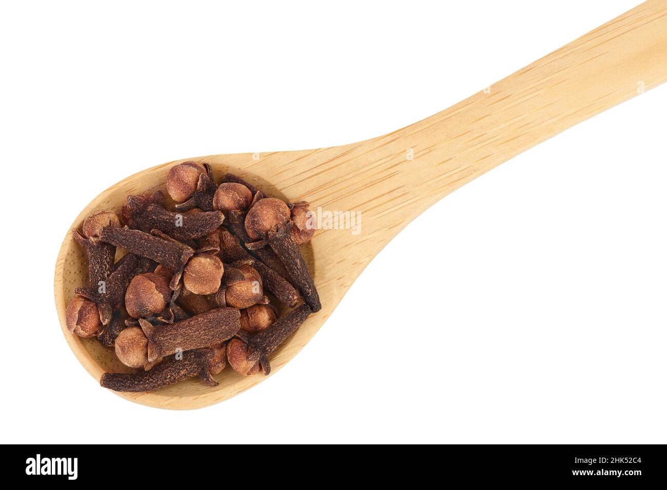 Dry spice cloves in wooden spoon isolated on white background with ...