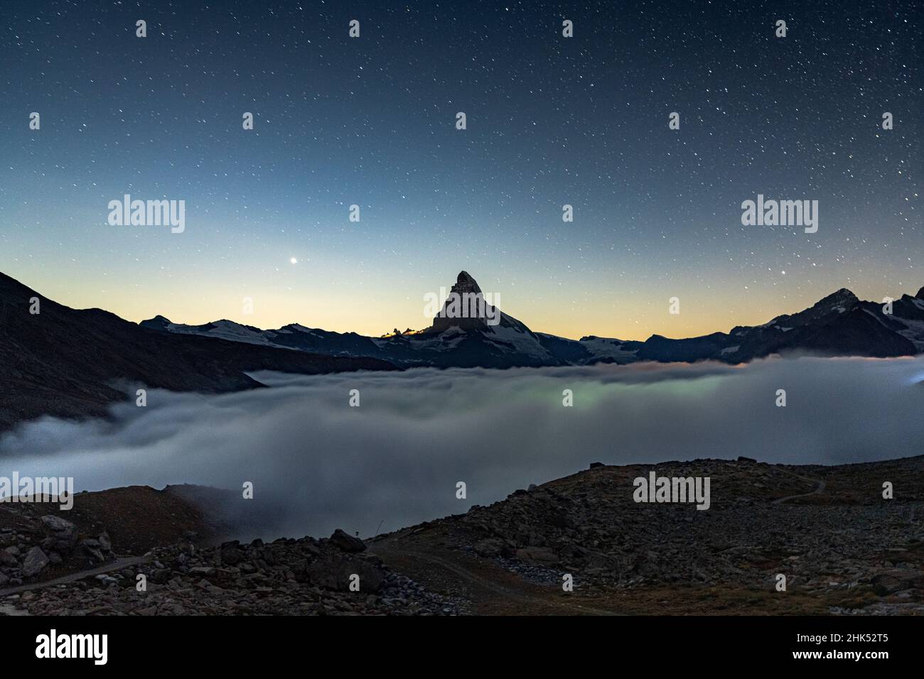 Starry night over Matterhorn in the mist, Zermatt, Valais Canton, Swiss ...