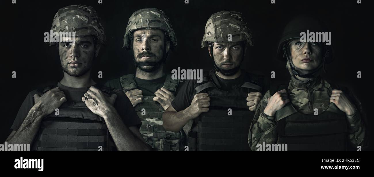 Conceptual collage with young male and female soldiers isolated on dark ...
