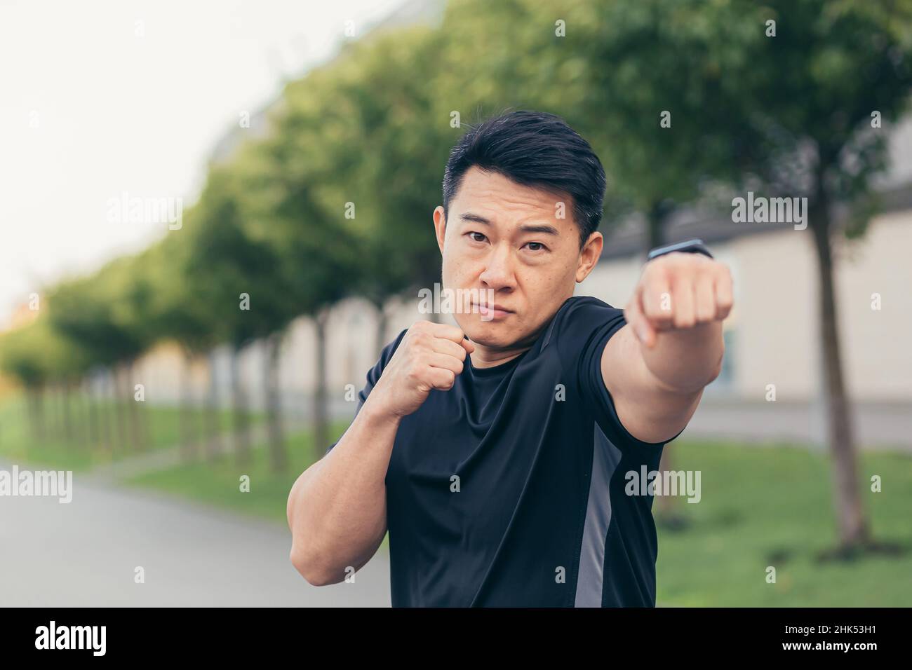 Serious asian male boxer hi-res stock photography and images - Alamy