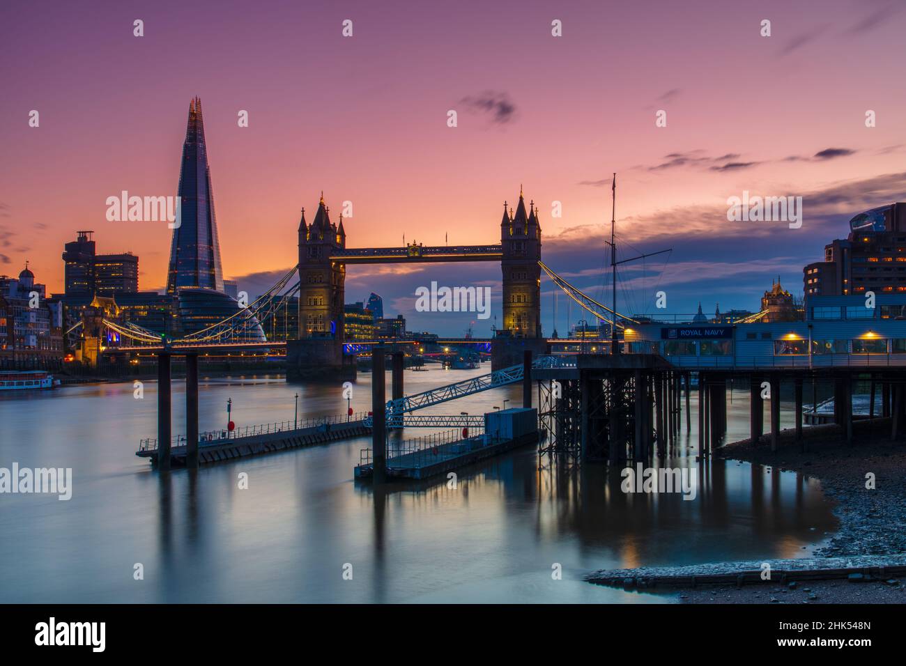 Tower Bridge and The Shard at sunset with a low tide on the River ...