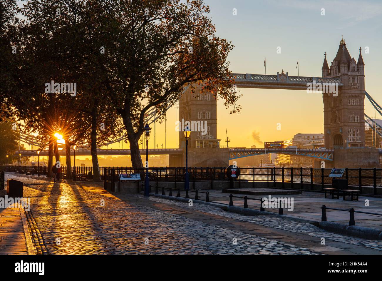 Autumn sunrise in grounds of the Tower of London, with Tower Bridge ...