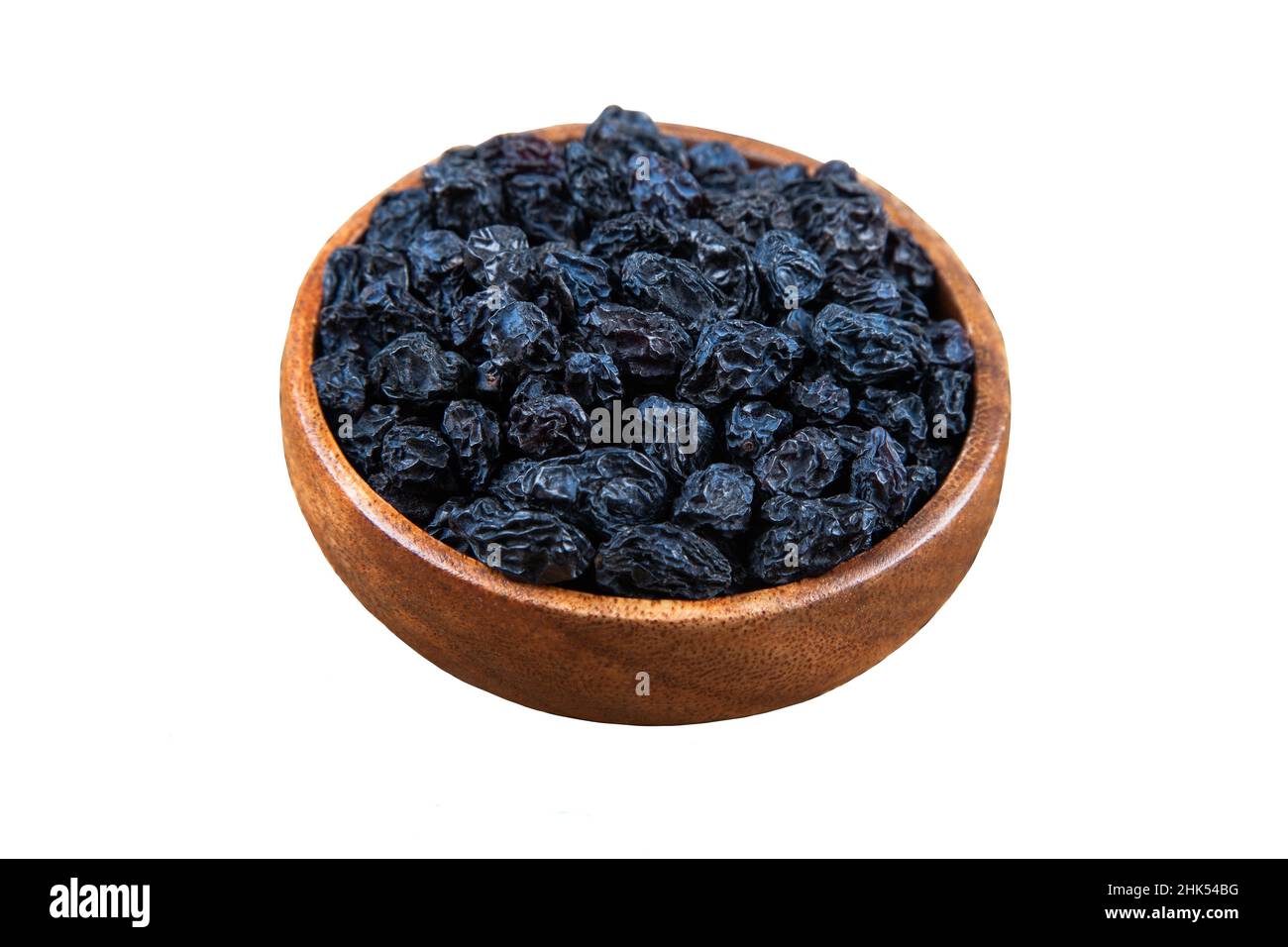 Black raisins of full bowl on white background Stock Photo - Alamy