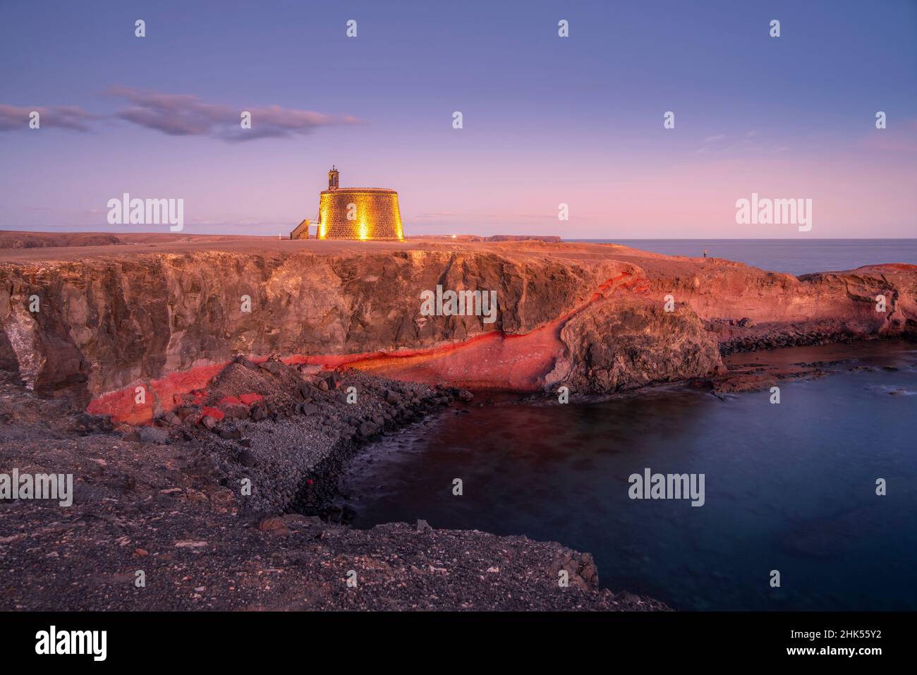 View of Castillo del Aguila o de las Coloradas at dusk, Playa Blanca ...