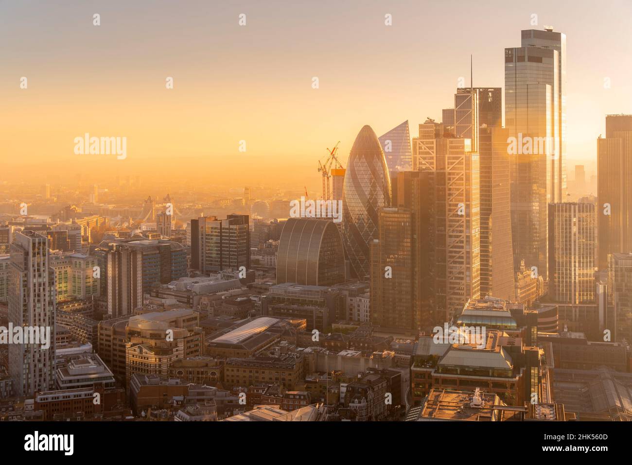View of City of London skyscrapers and Tower Bridge at golden hour from ...