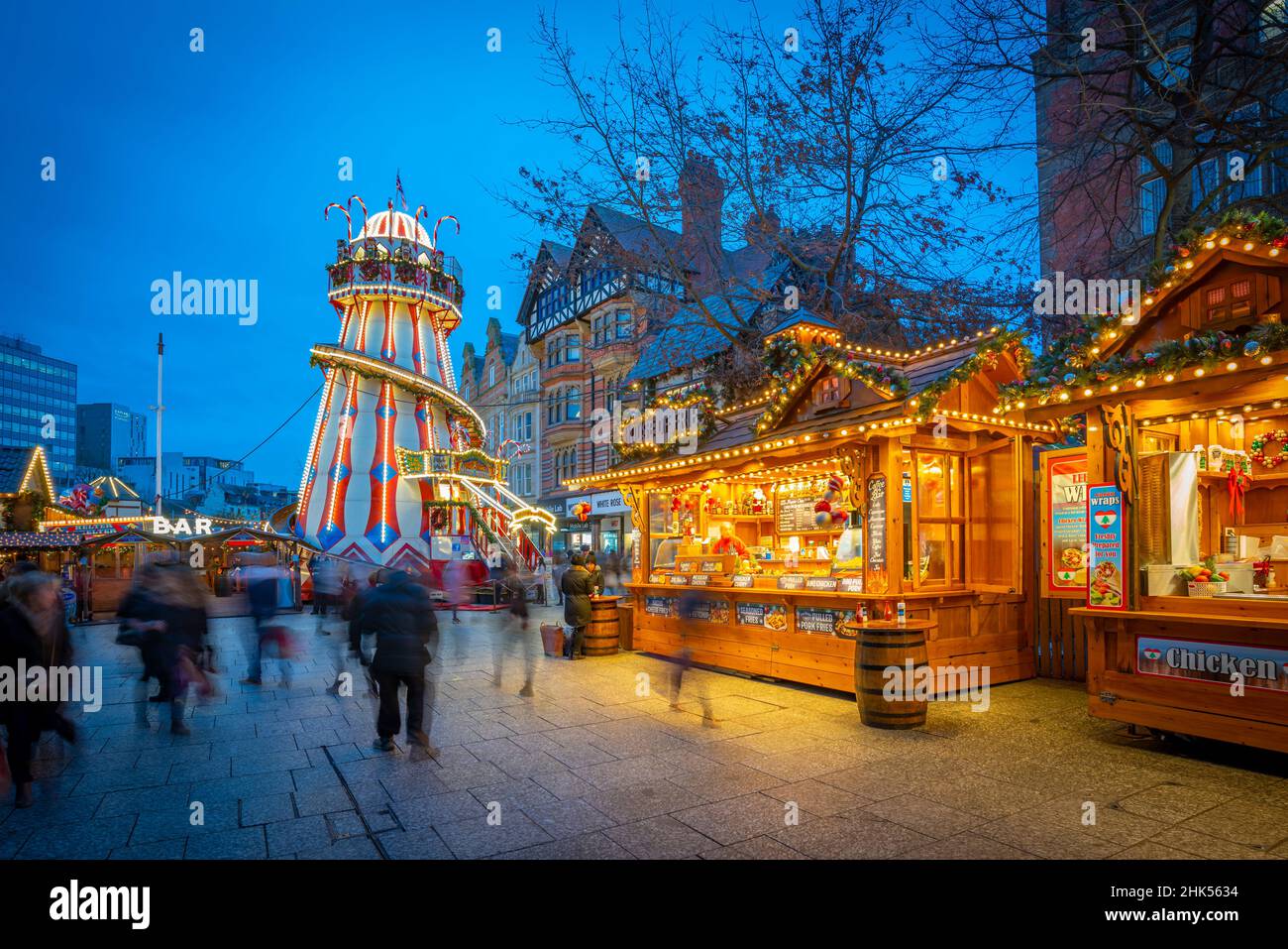 View of Christmas market stalls and helter skelter on Old Market Square ...