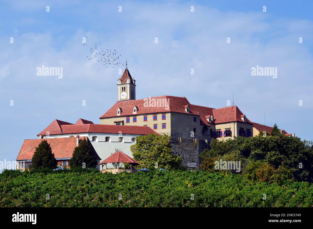 Austria, the medieval fortified castle is enthroned on a rock above the ...