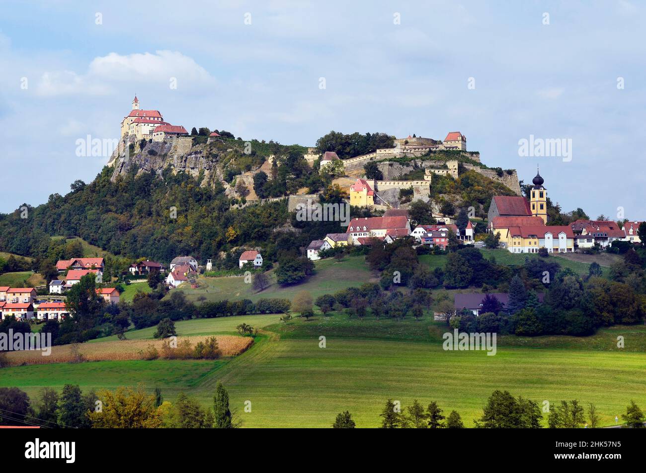 Austria, the medieval fortified castle is enthroned on a rock above the ...