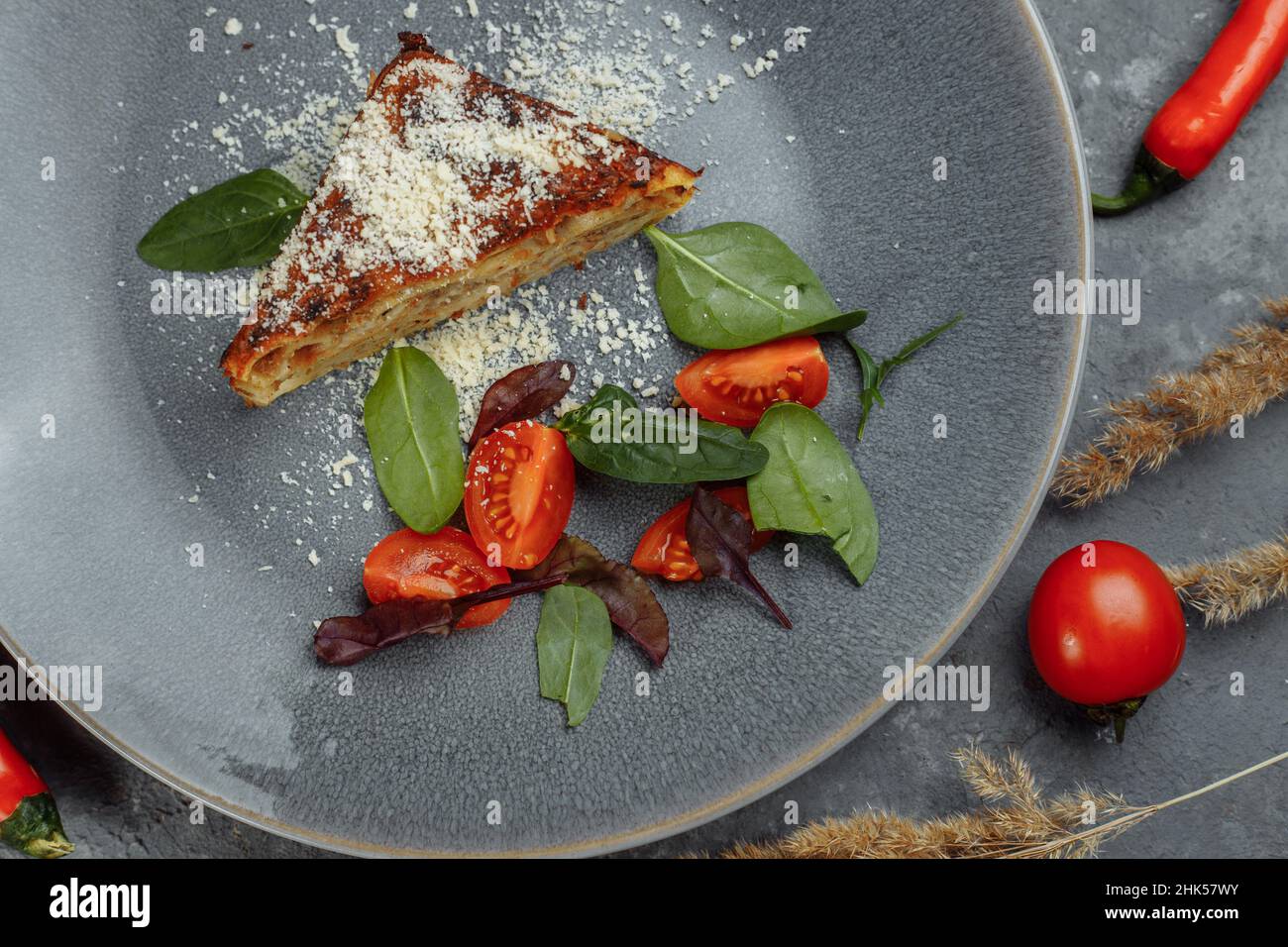 Homemade delicious Meat lasagna with basil leaf on the top. Close up ...