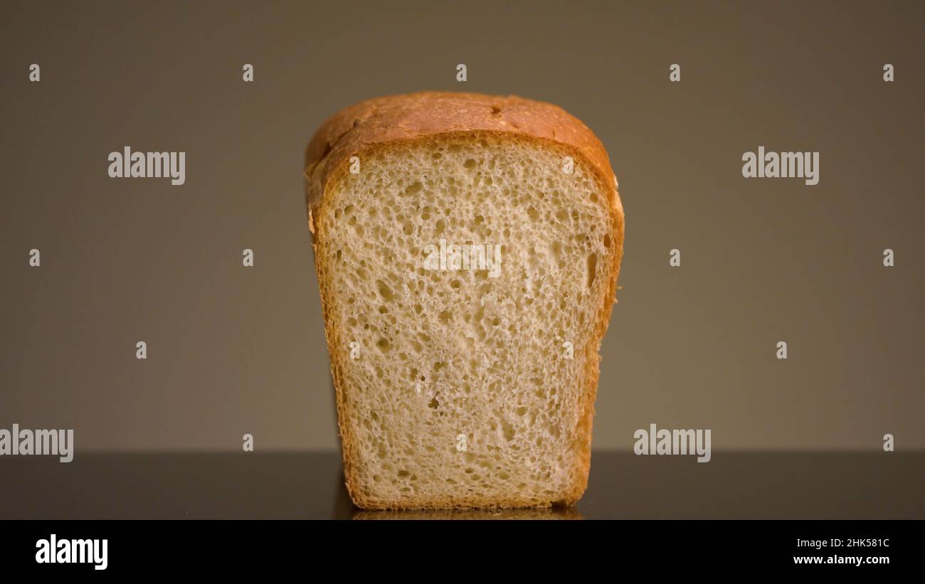 Close-up of man taking bread. Stock footage. Loaf of white bread with ...