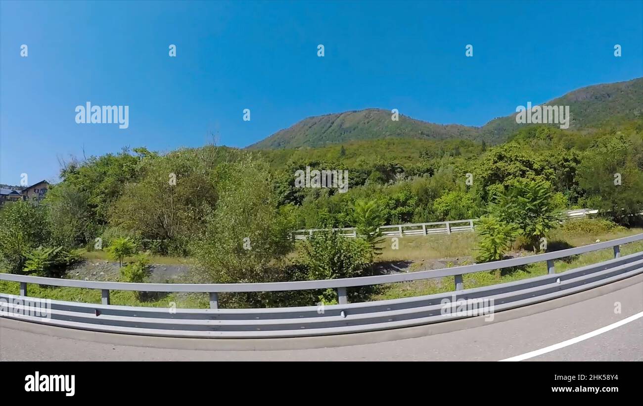 Driving through Mountain landscape. Scene. Drive through the mountains ...