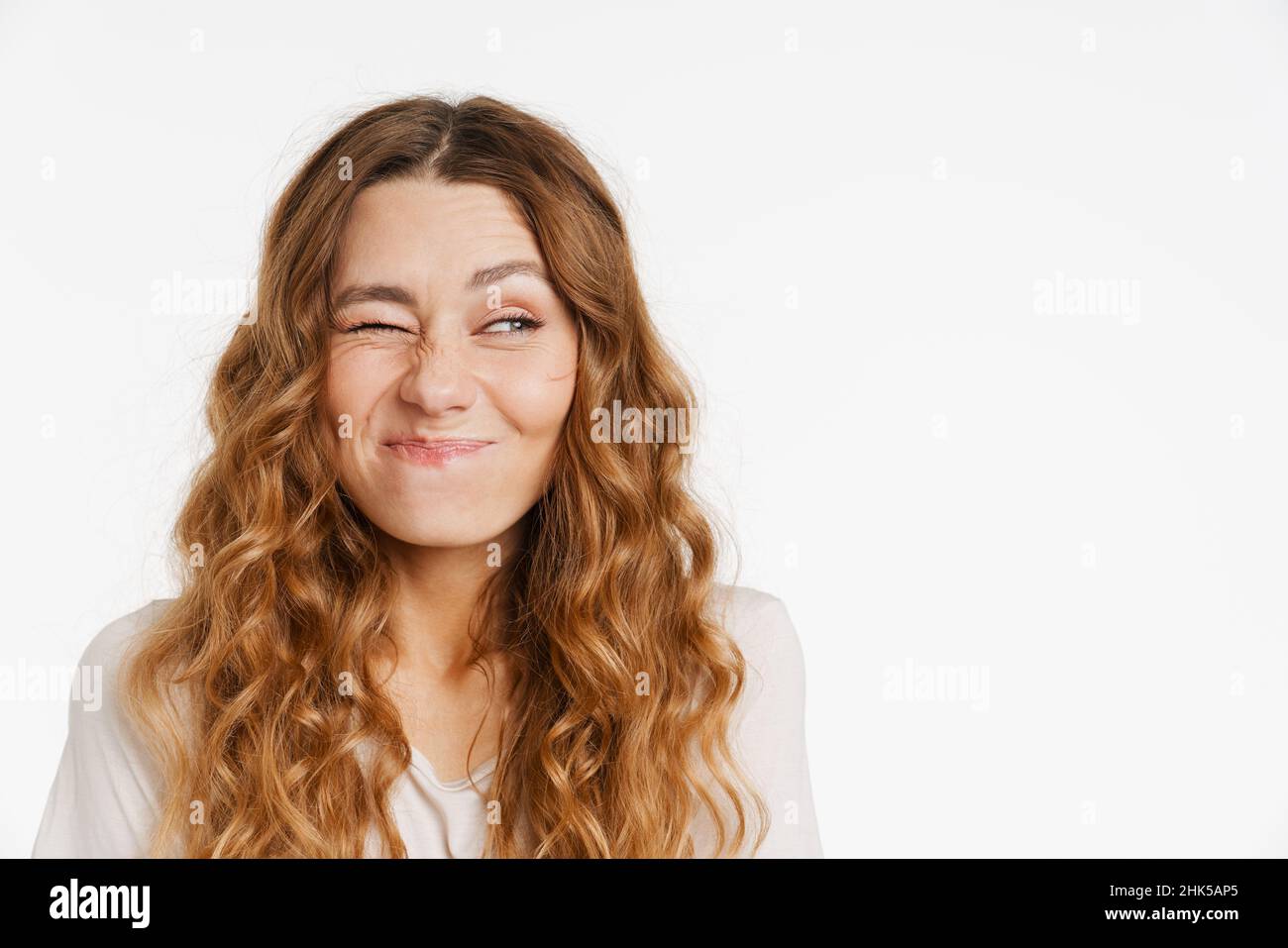 Young ginger woman winking hi-res stock photography and images - Alamy