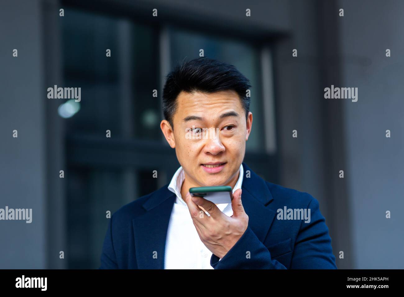 angry and serious Successful Asian businessman explains information to ...